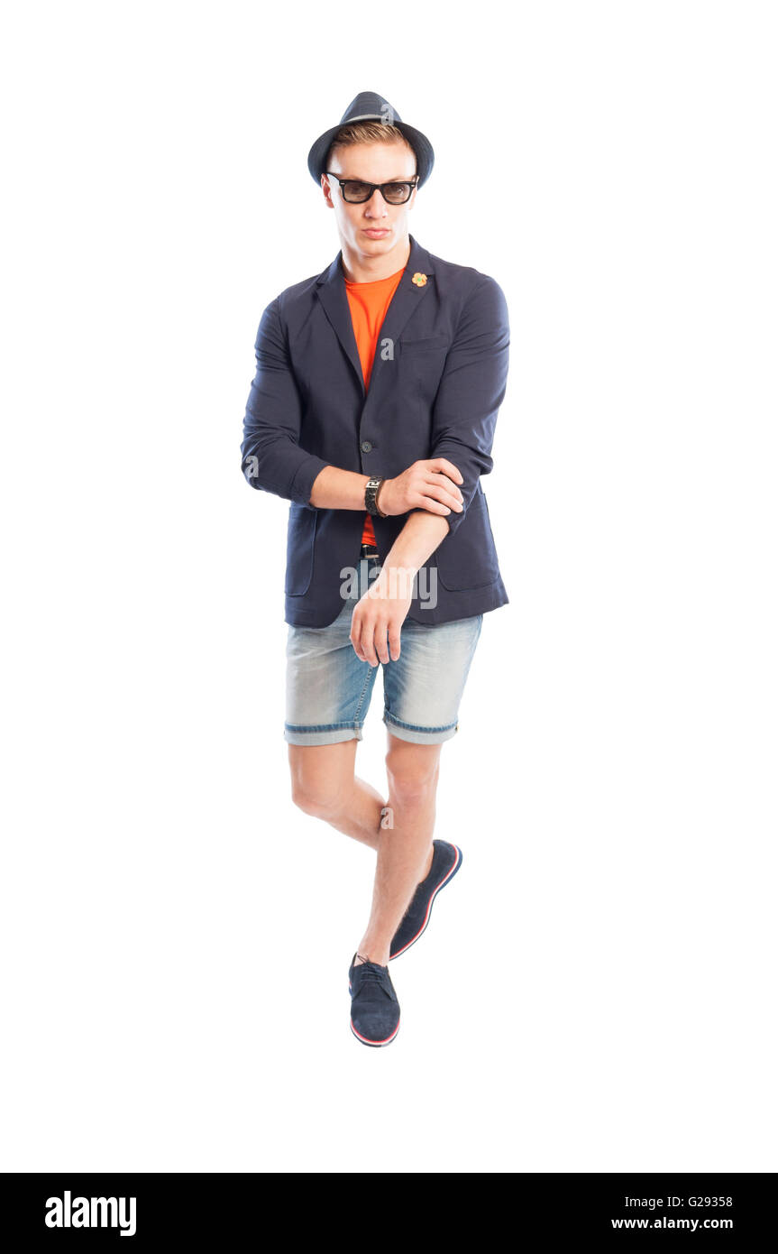 Fashion male model wearing t-shirt, elegant jacket, short jeans, hat ...