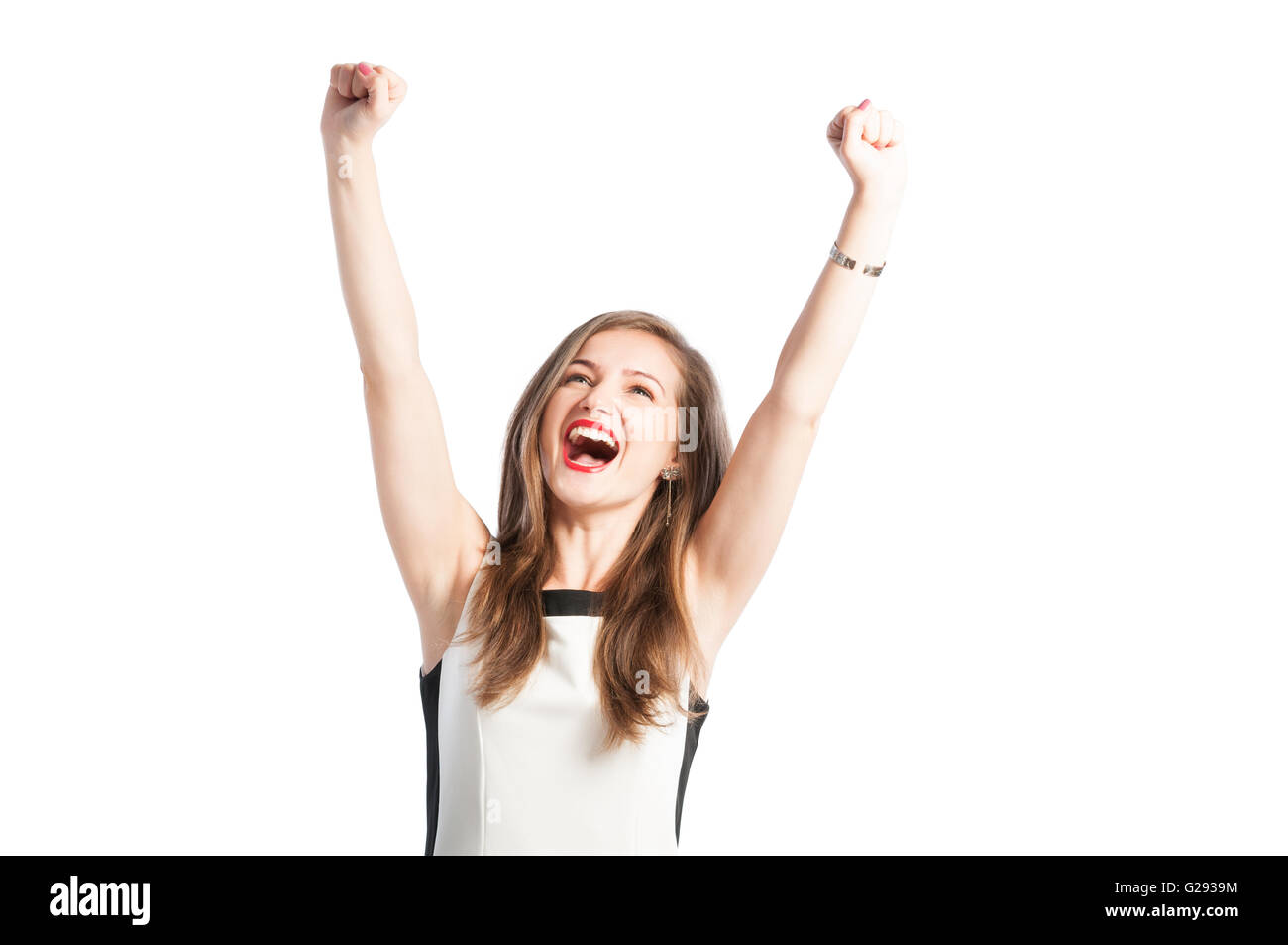 Portrait of a successful business woman raising arms up in the air and ...