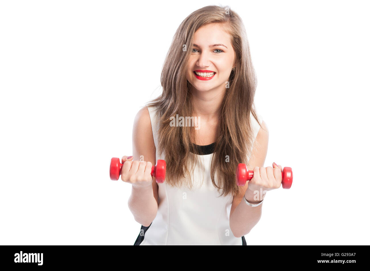 Beautiful female model lifting small red weights Stock Photo - Alamy