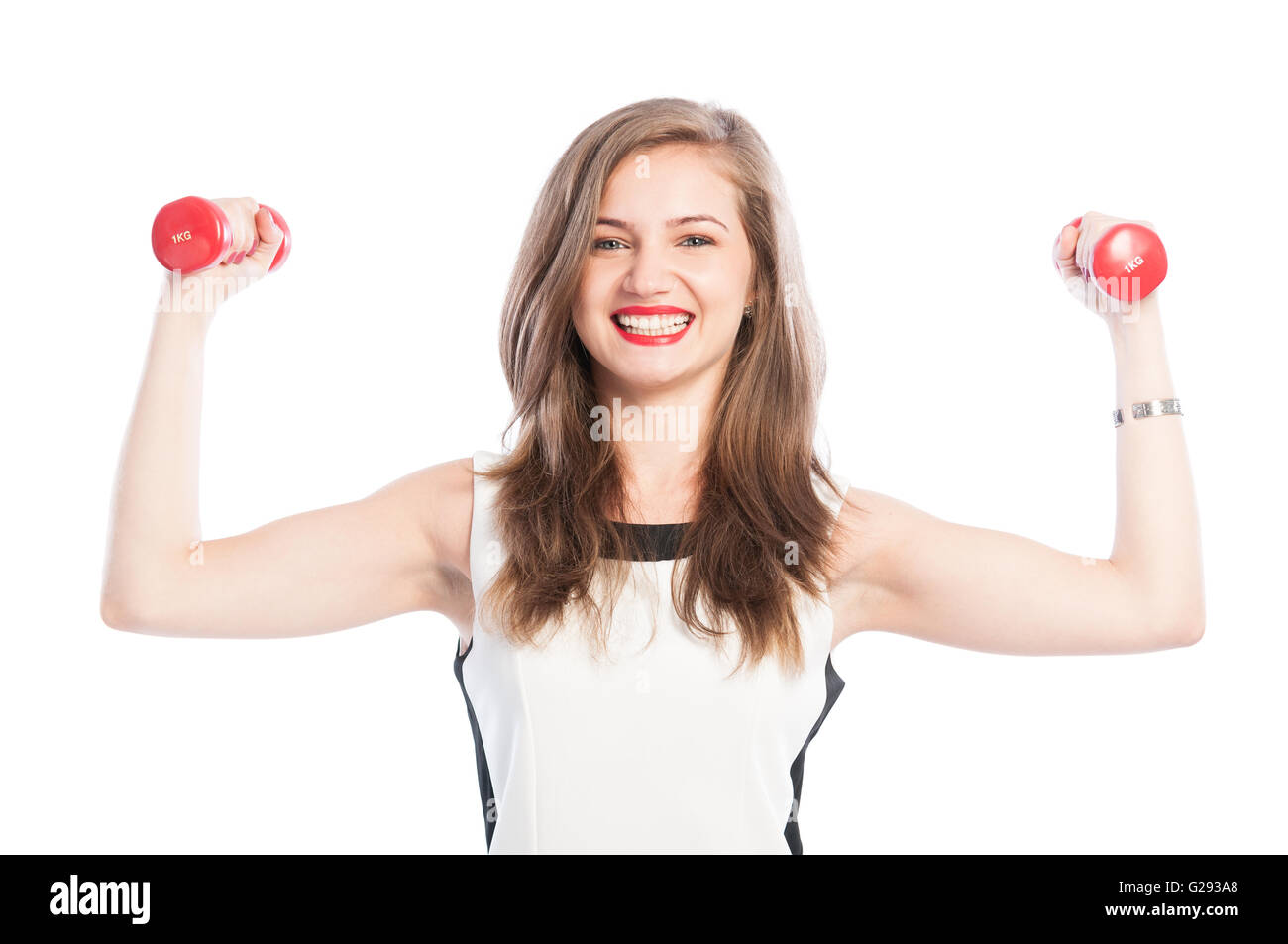 Smiling woman lifting small red weights with both hands Stock Photo - Alamy
