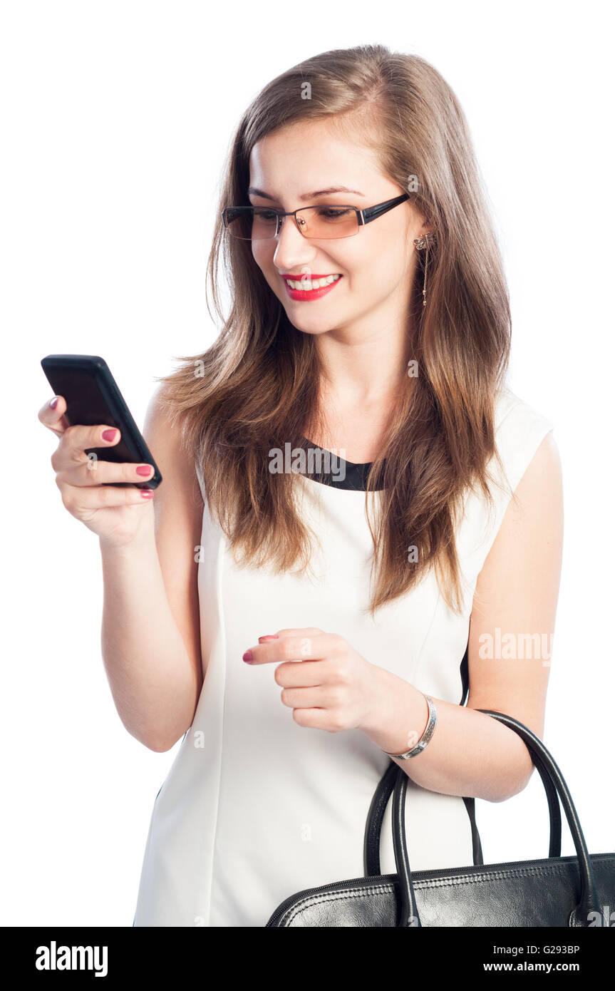 Business woman checking her smartphone isolated on white background ...