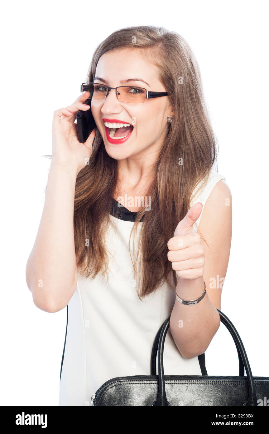 Business woman talking on smartphone and showing thumb-up isolated on ...