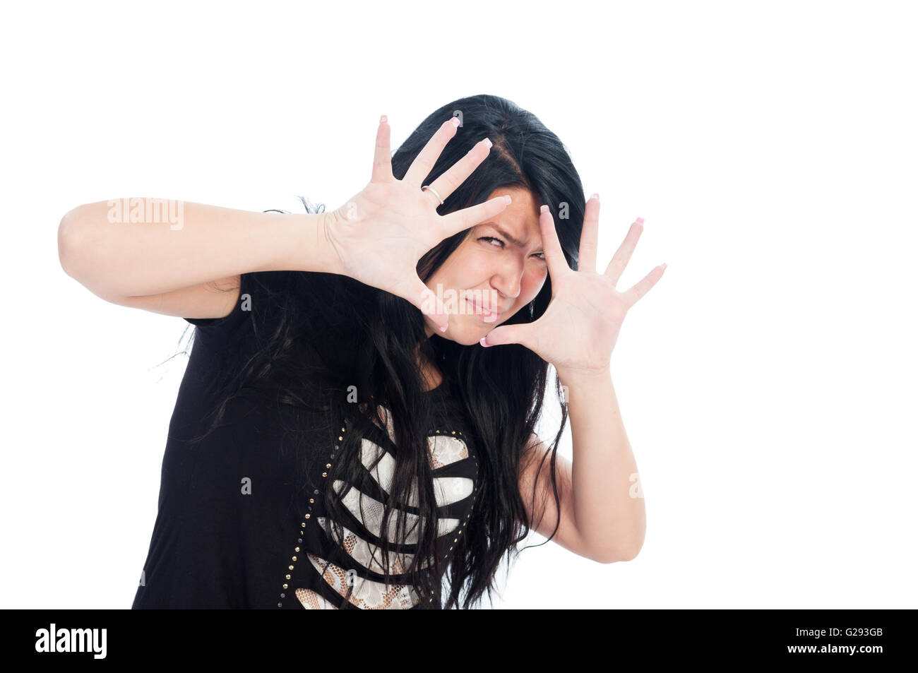 Brunette girl acting scared isolated on white background Stock Photo ...
