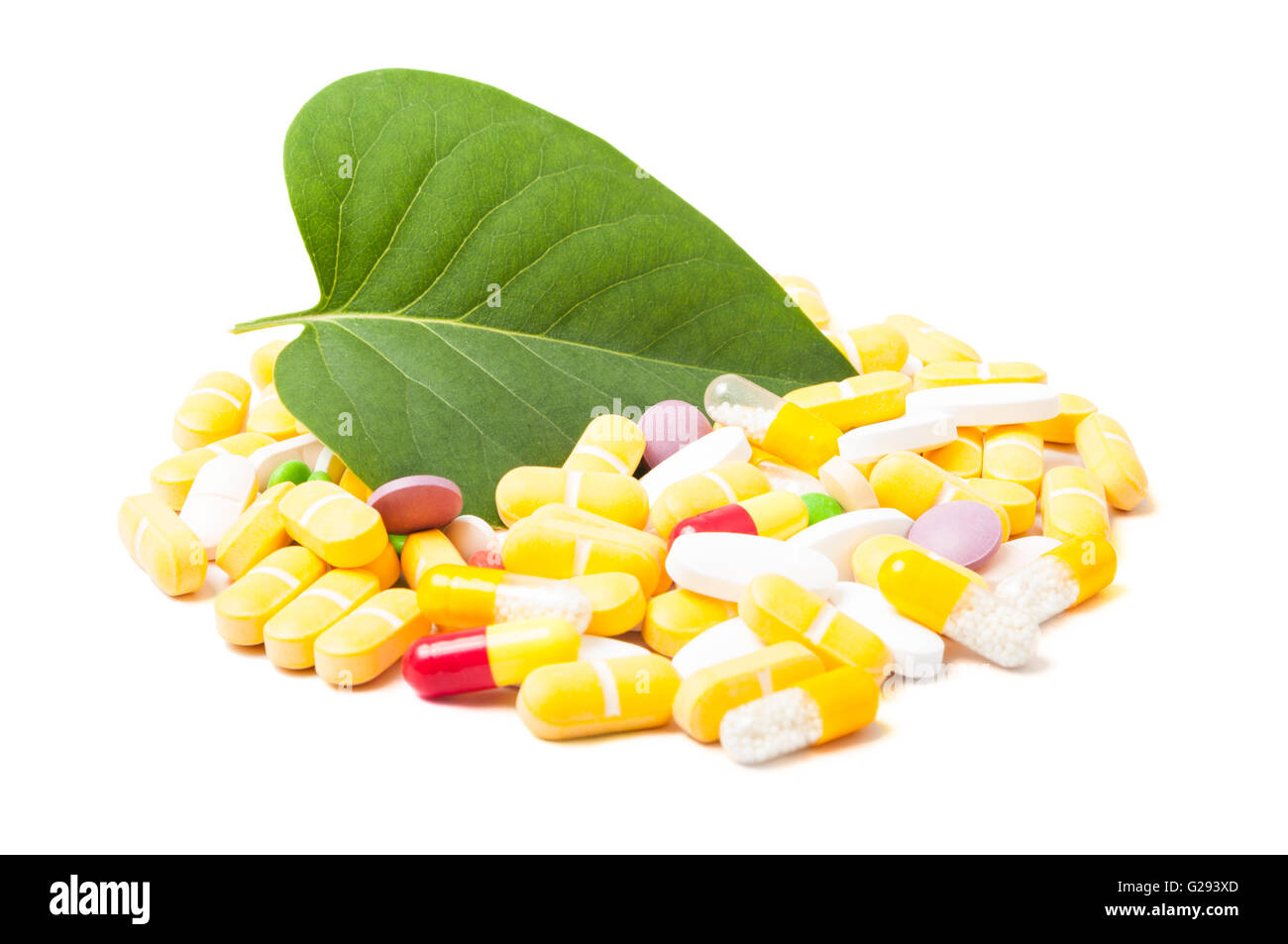 Green leaf and bunch of pills isolated on white background Stock Photo ...