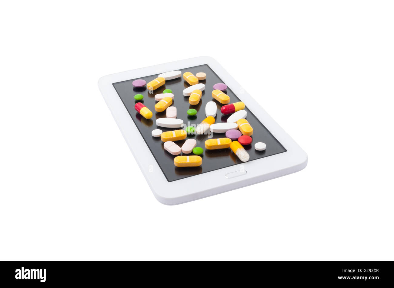 Bunch of colored pills on a touchscreen tablet isolated white ...