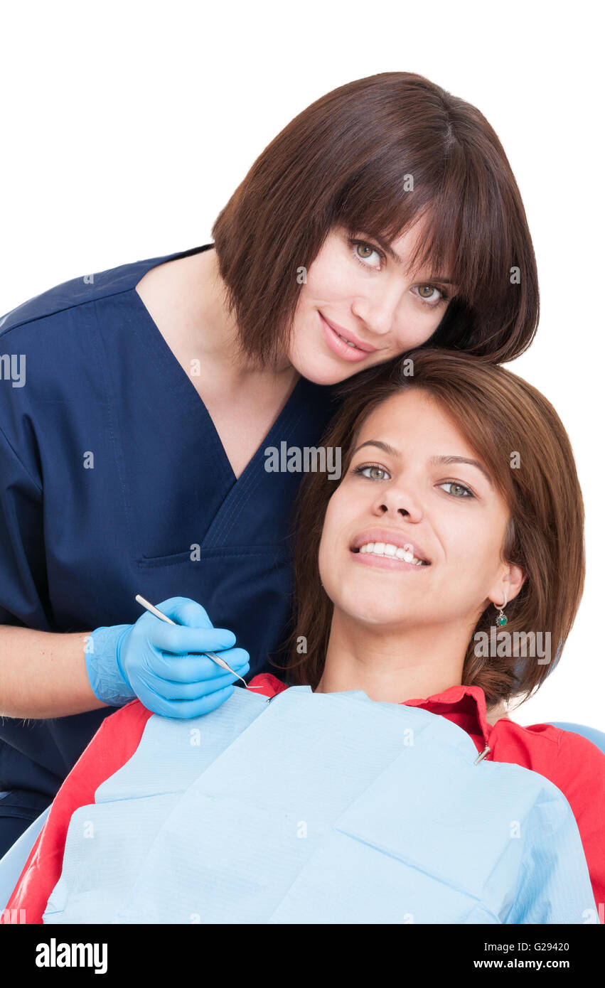 Beautiful woman dentist and smiling female patient on white background ...