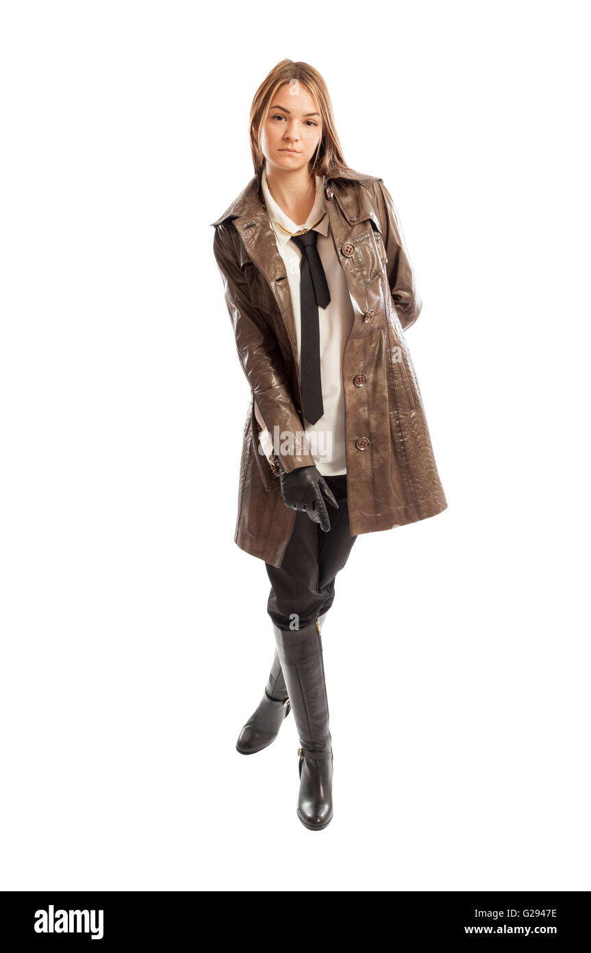 Beautiful young female model with confident attitude posing on white ...