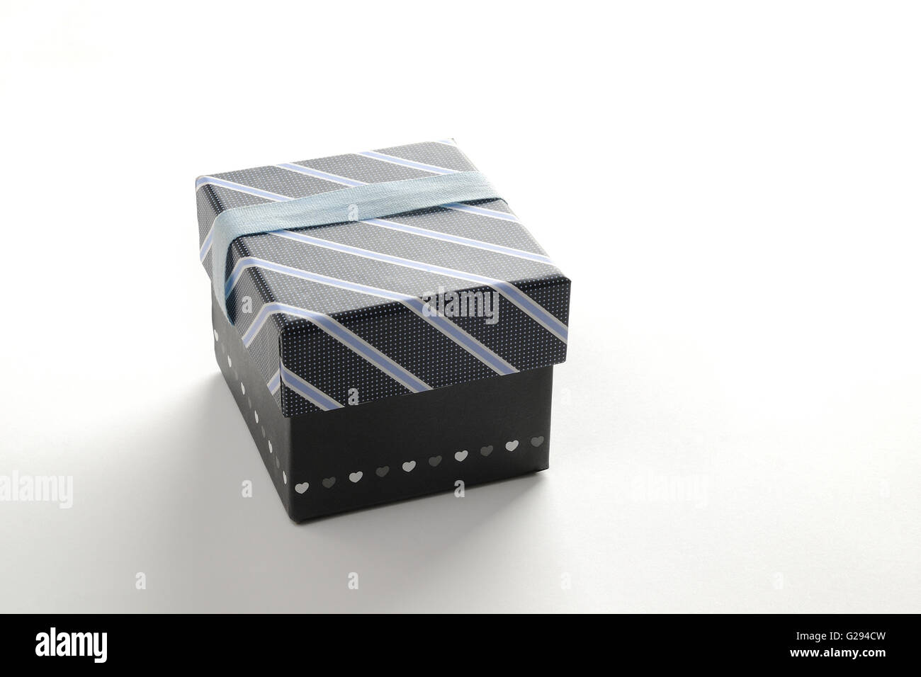 Decorative black gift box with with ribbon and blue diagonal lines ...