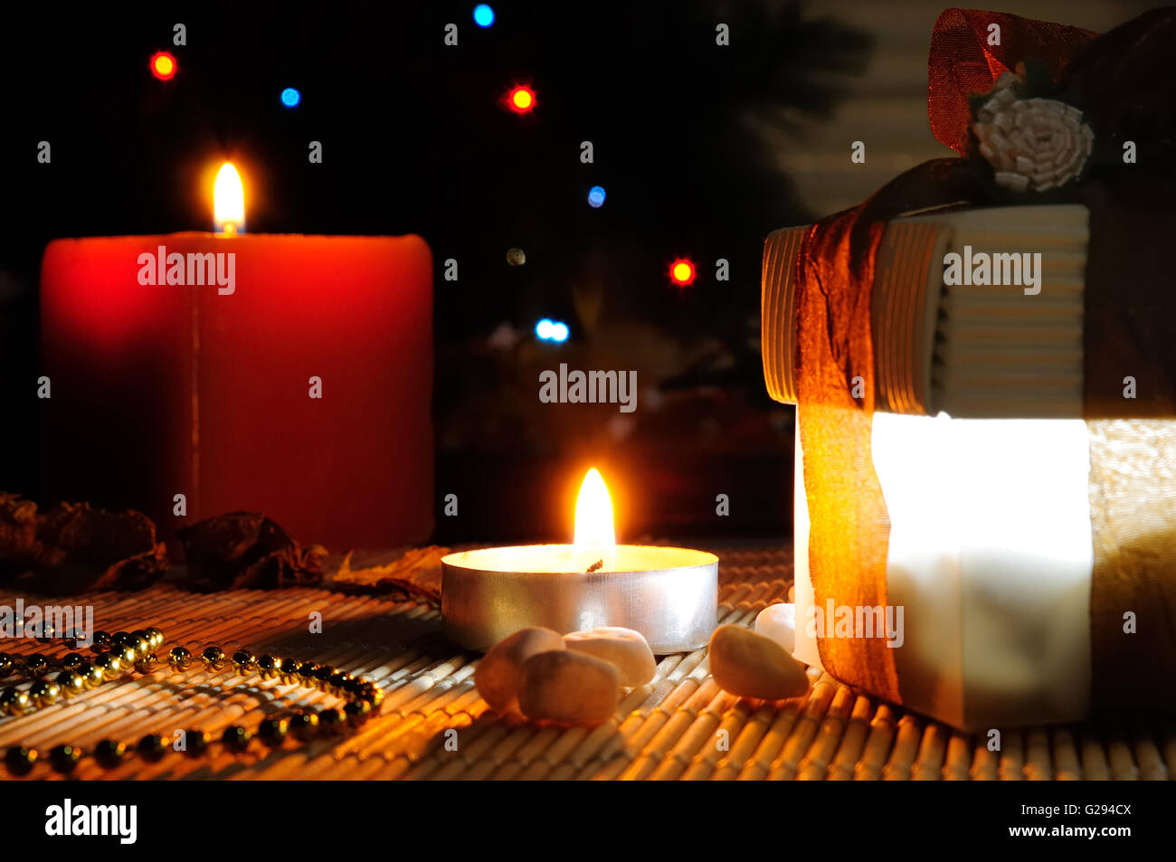 night Christmas gift with two candles Stock Photo - Alamy