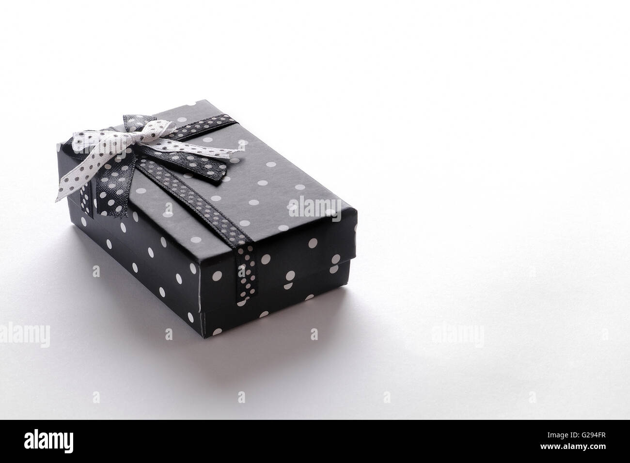 Decorative small black rectangular box gift with black and white ribbon ...