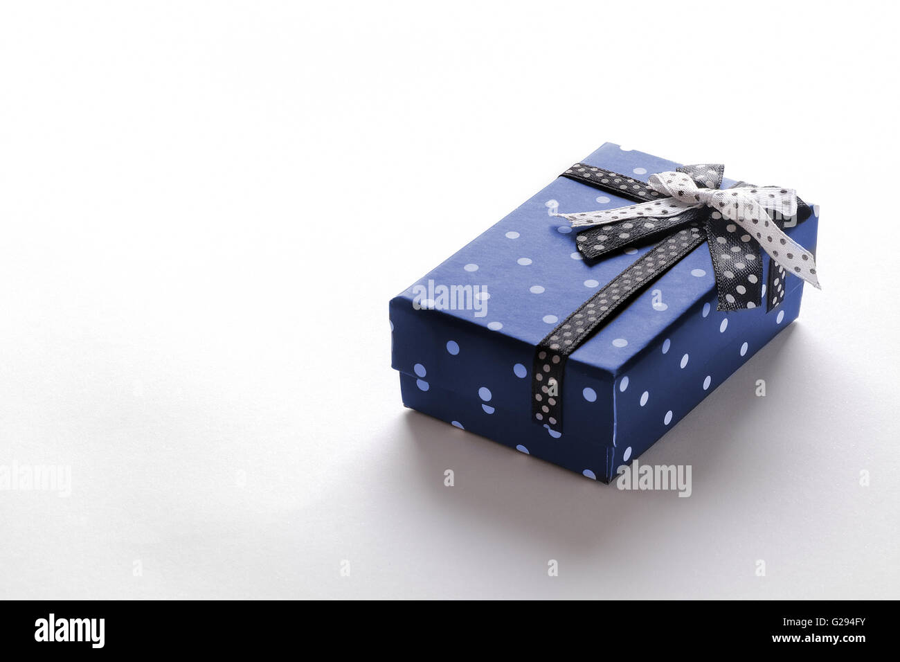Decorative small blue rectangular box gift with black and white ribbon ...