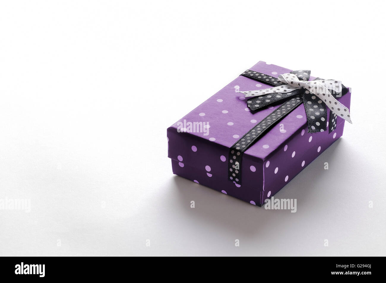 Decorative small purple rectangular box gift with black and white ...