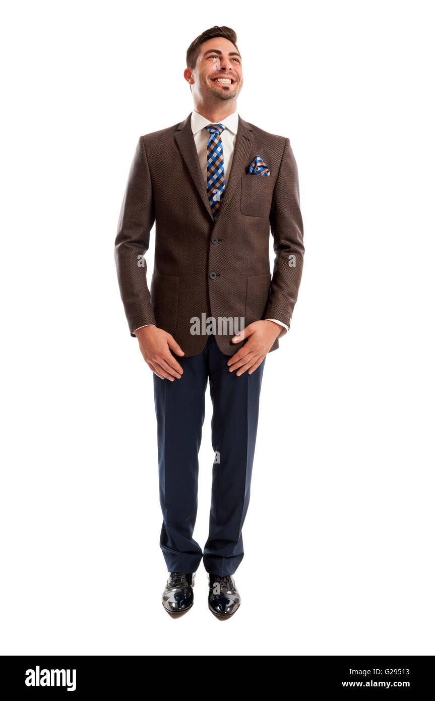 Happy sales man laughing and looking up on white studio background ...