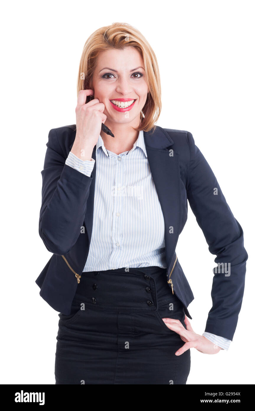 Successful business woman thinking on what to write and smiling Stock ...