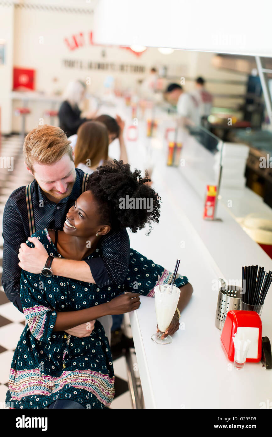 Couple hugging by the bar in the diner Stock Photo - Alamy