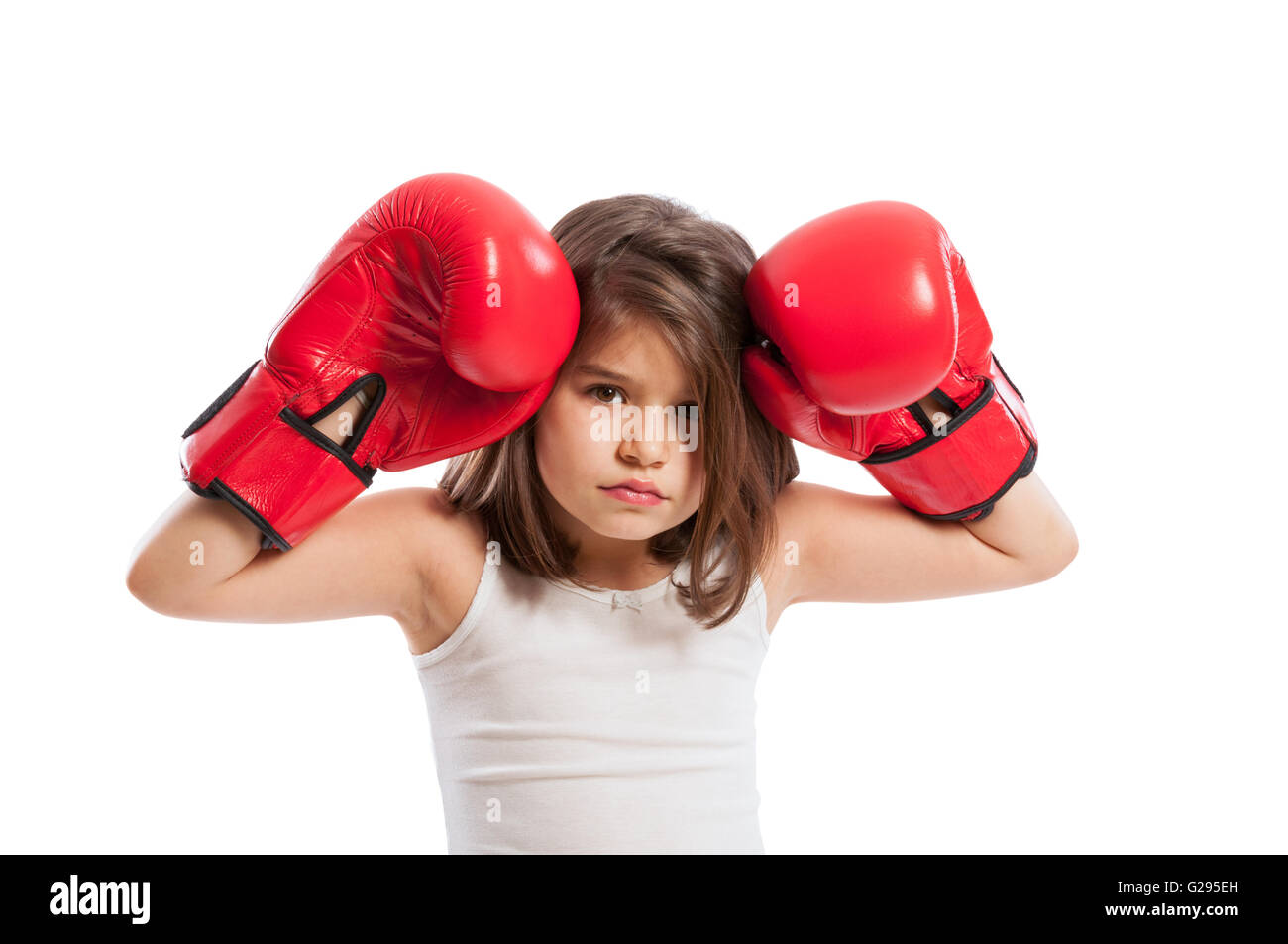 Young and sad boxer girl wearing red boxing gloves isolated on white ...