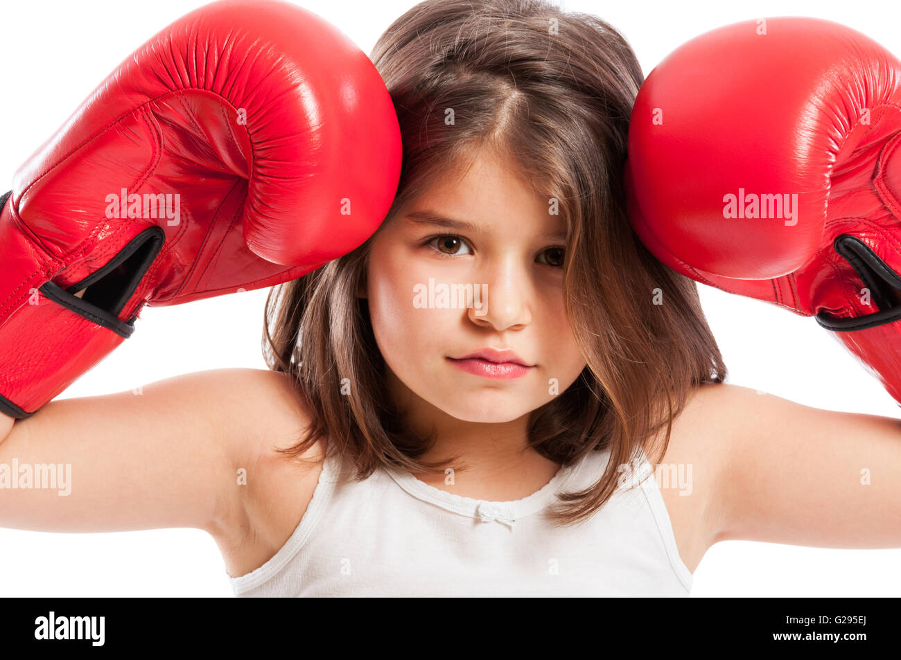 Young boxer girl acting angry or mad and wearing red boxing gloves ...