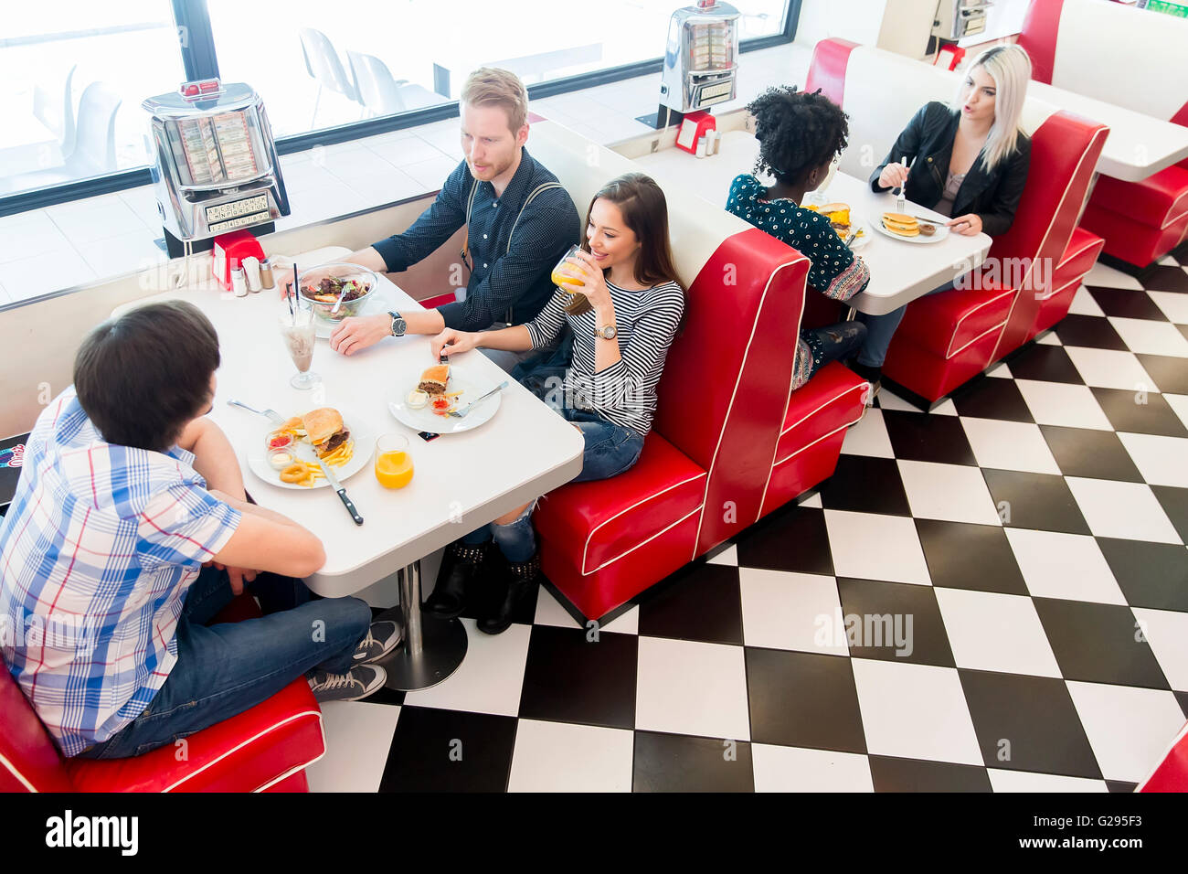 Sitting at diner table hi-res stock photography and images - Alamy
