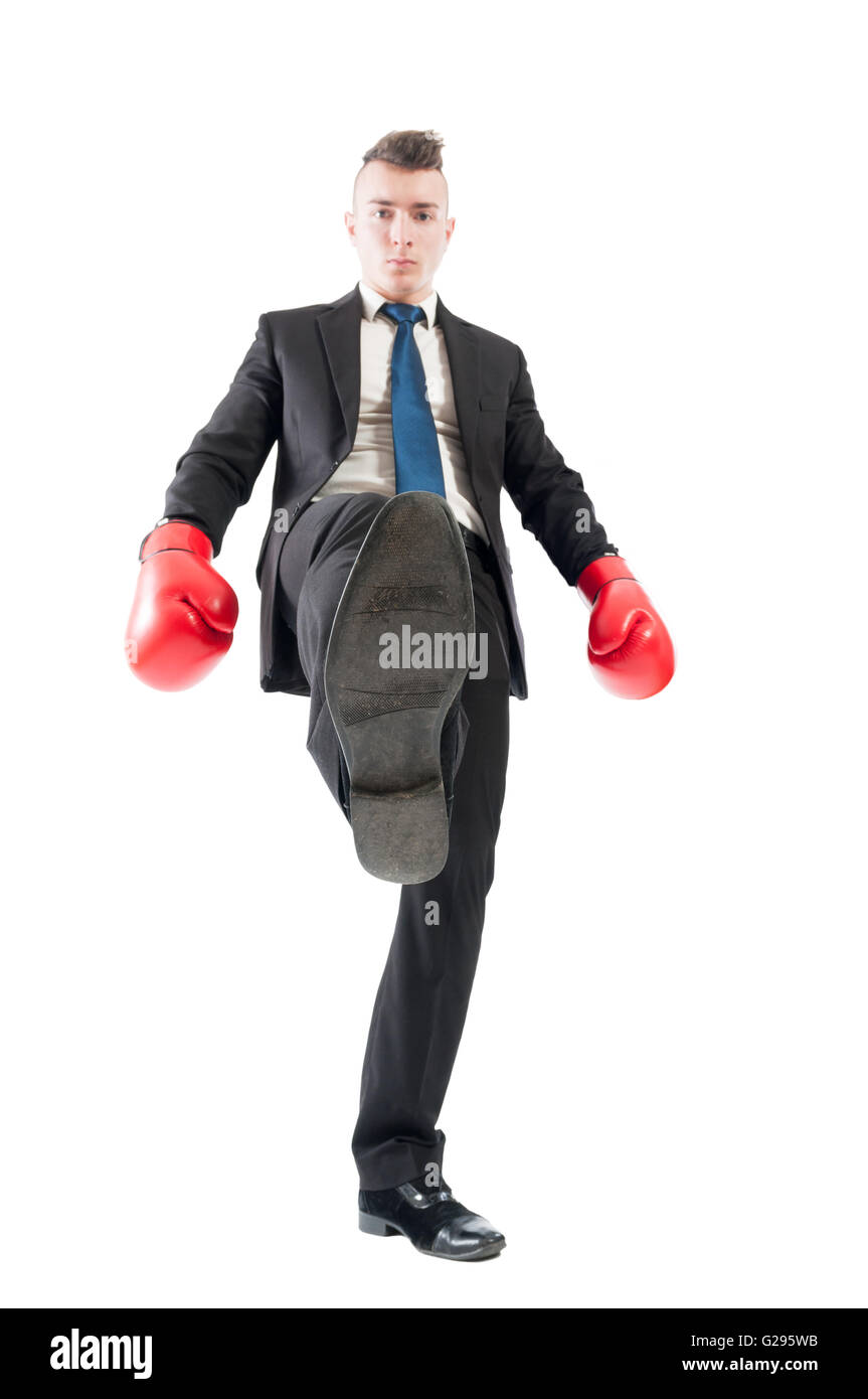 Competitive and aggresive business man tread over the competitors ...