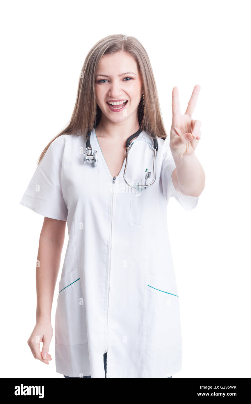 Woman doctor showing peace or victory gesture on white background Stock ...