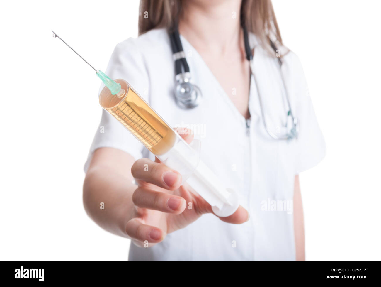Woman doctor showing a syringe to the camera with closeup and focus on ...