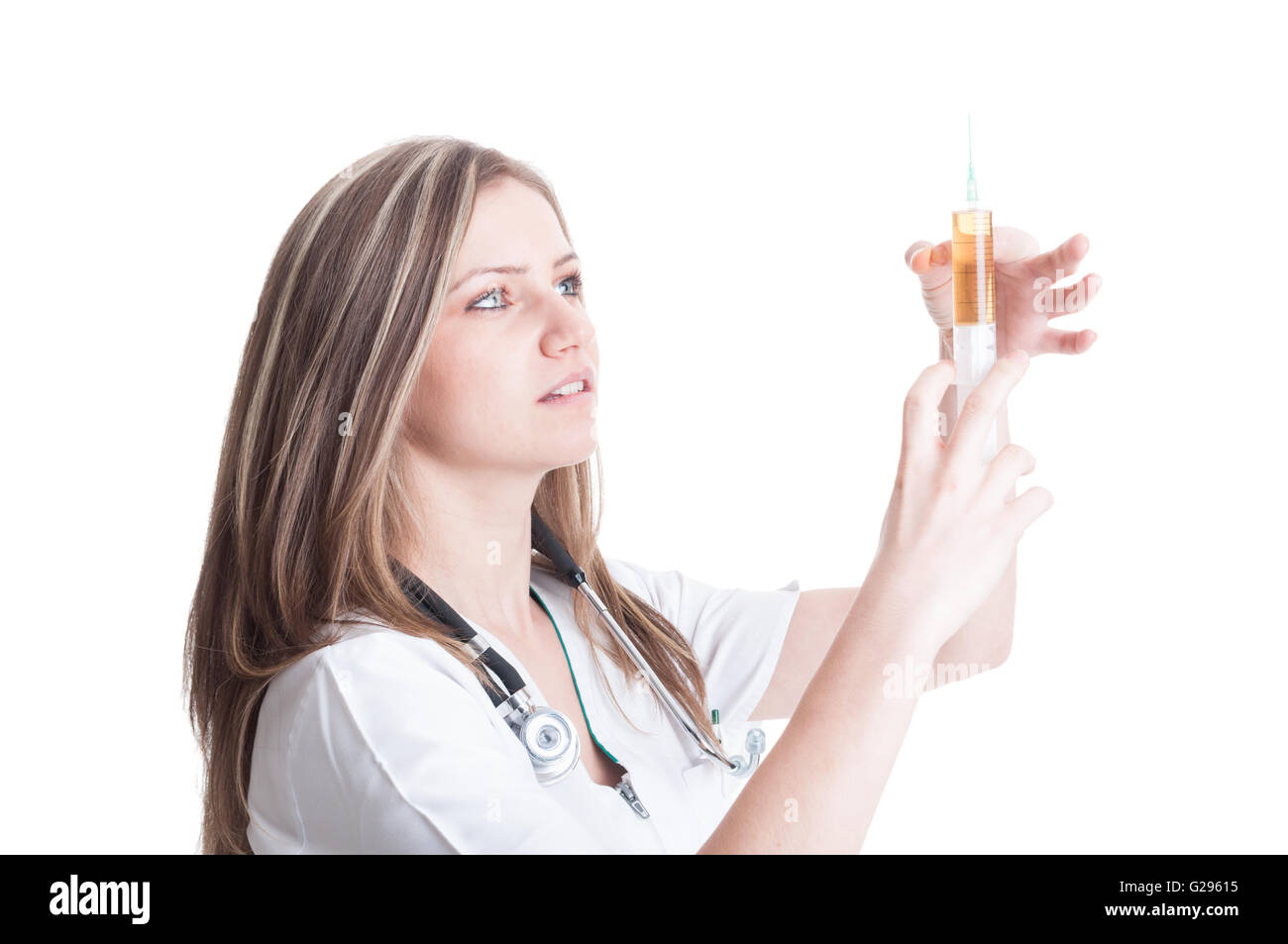 Beautiful, friendly and young woman doctor preparing a syringe for ...