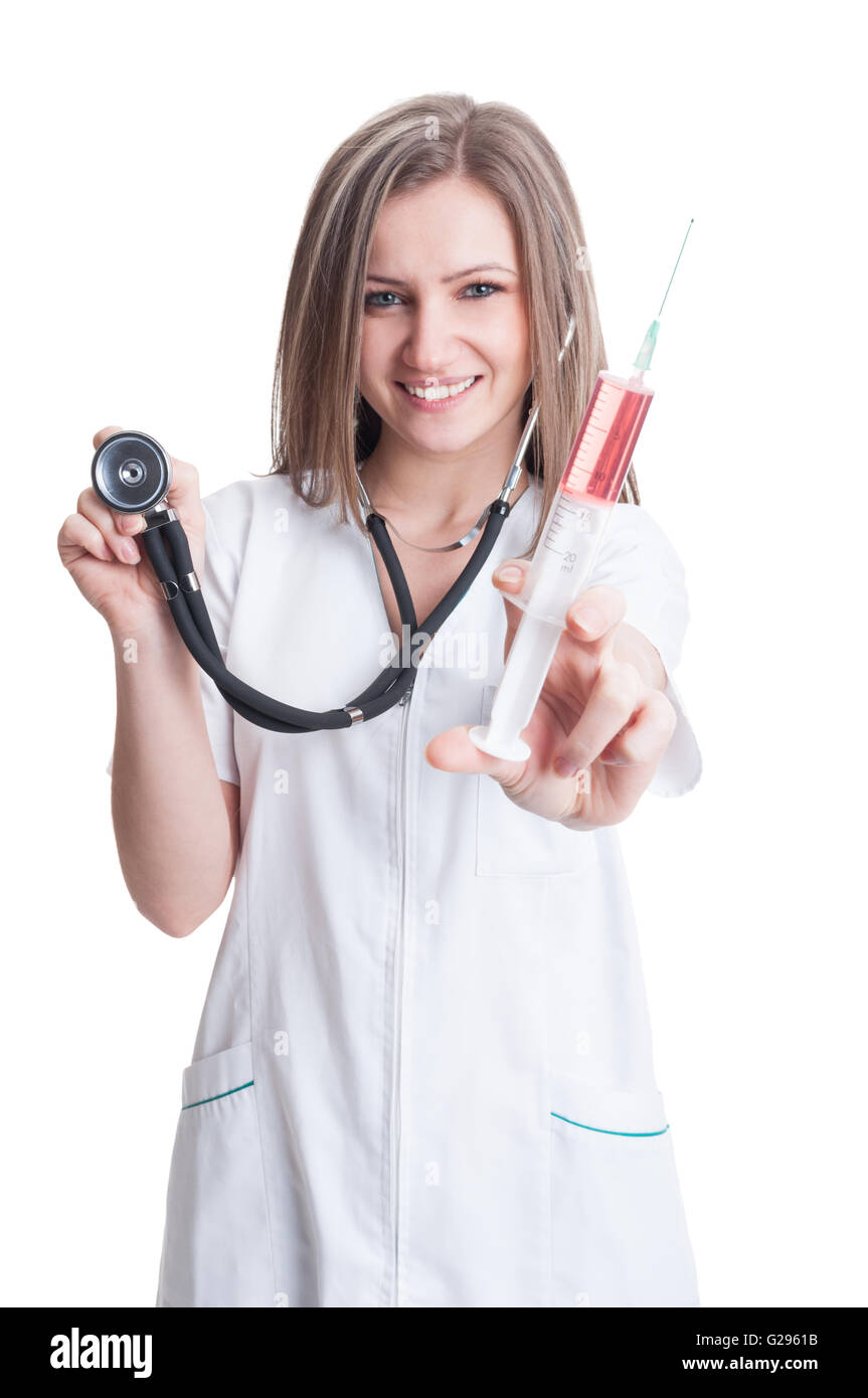 Adorable and young medic woman holding syringe and stethoscope isolated ...