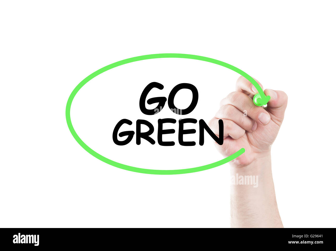 Go green concept text write on transparent wipe board by hand holding a ...