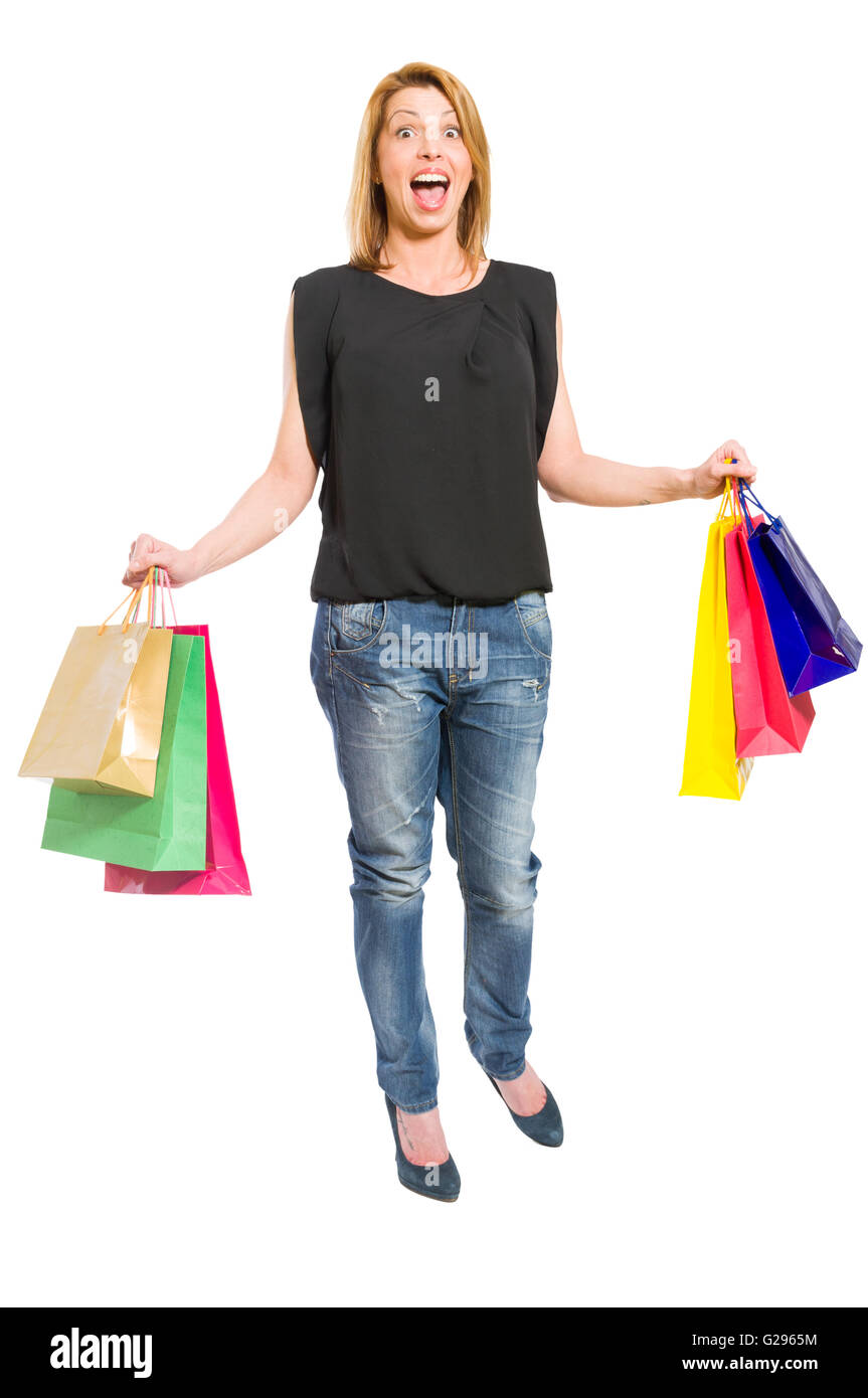 Excited shopping woman acting surprised on white backrgound Stock Photo ...