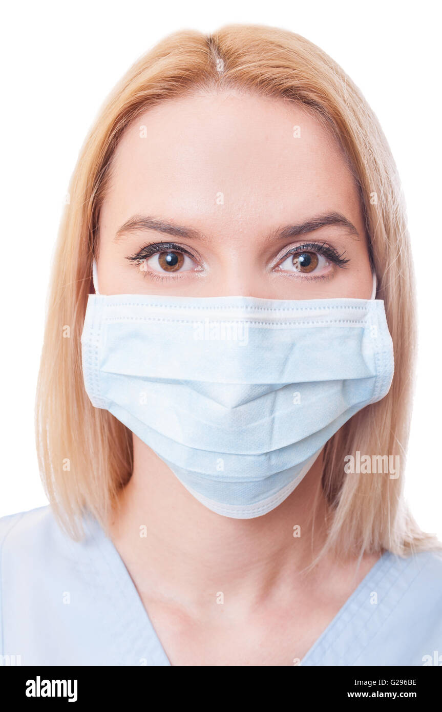 Portrait of a beautiful woman doctor wearing surgical mask isolated on ...