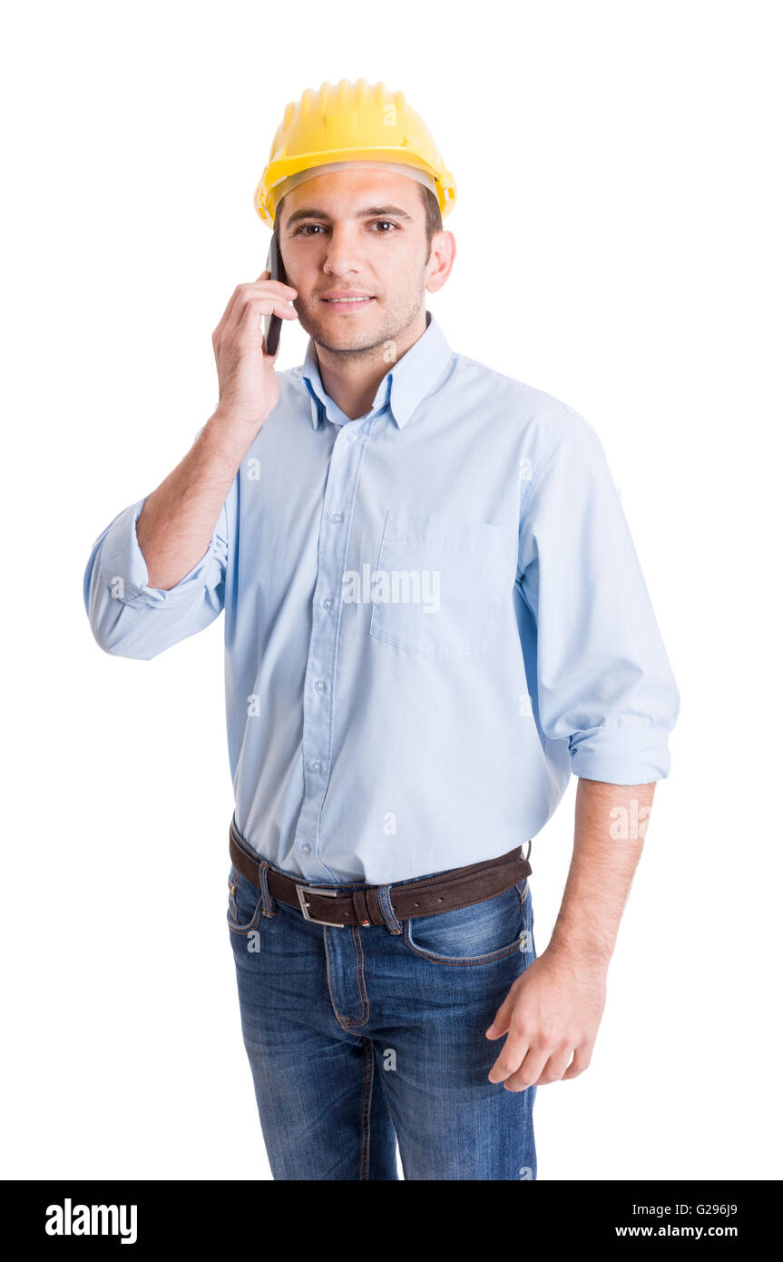 Portrait of a modern engineer talking on smartphone isolated on white ...