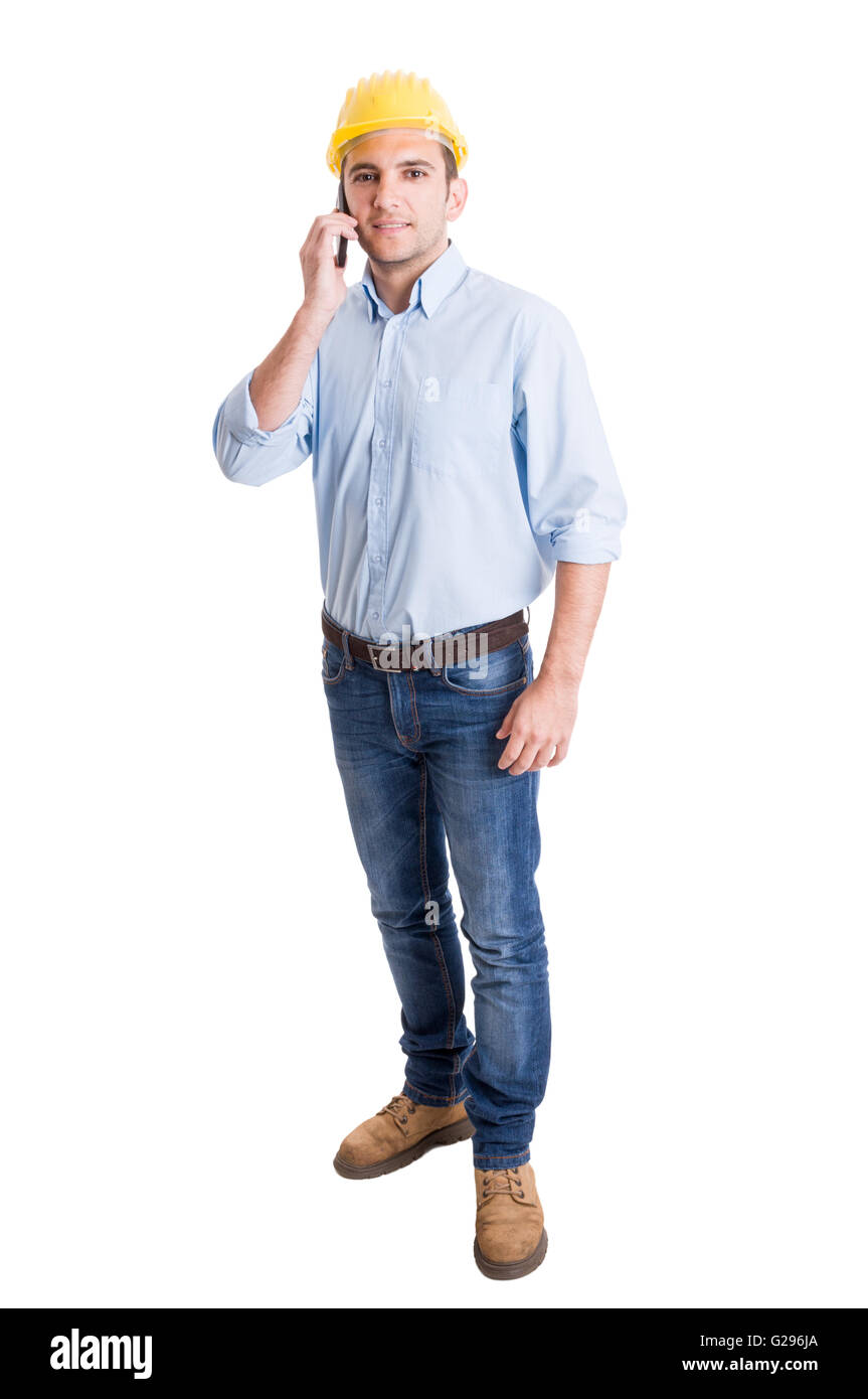 Young and modern engineer talking on smartphone isolated on white ...