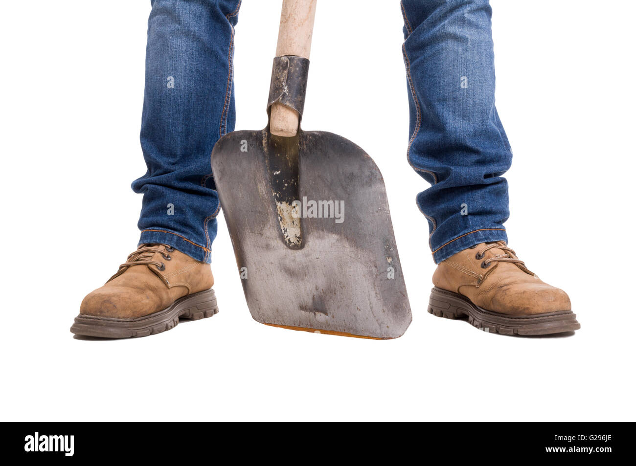 Builder feet with a shovel between. Construction worker concept Stock ...
