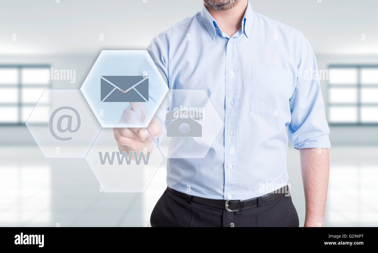 Contact us using mail address concept with man pressing button on ...