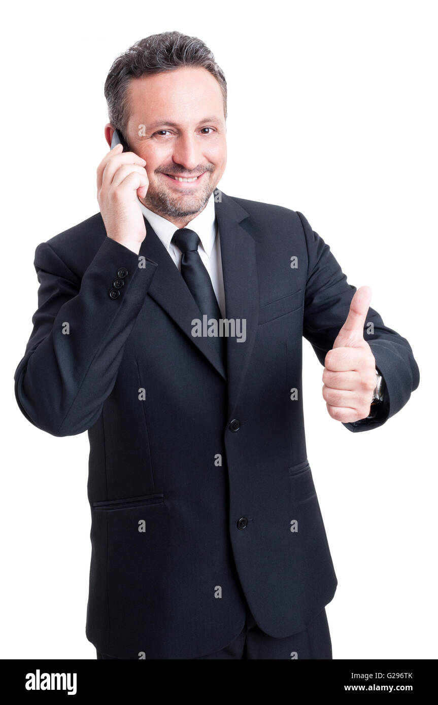 Business man talks on the phone and shows thumb up. Confident salesman ...