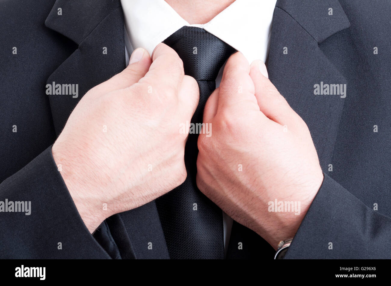 Closeup with formal business man fixing white shirt collar Stock Photo ...