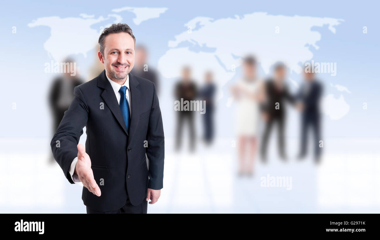 Friendly business manager leaning for hand shake on business people ...