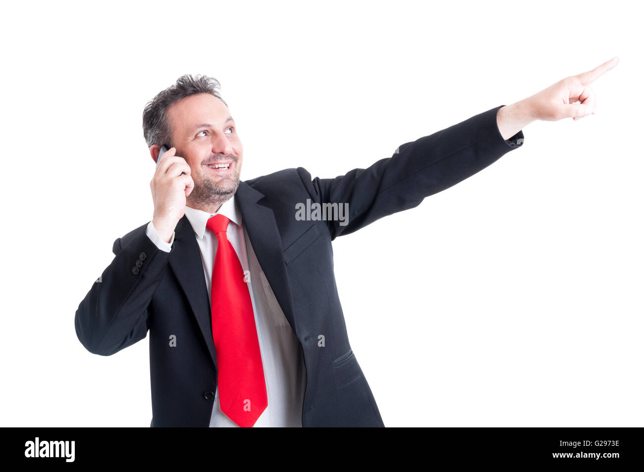 Business man pointing finger up to the future while talking on the ...