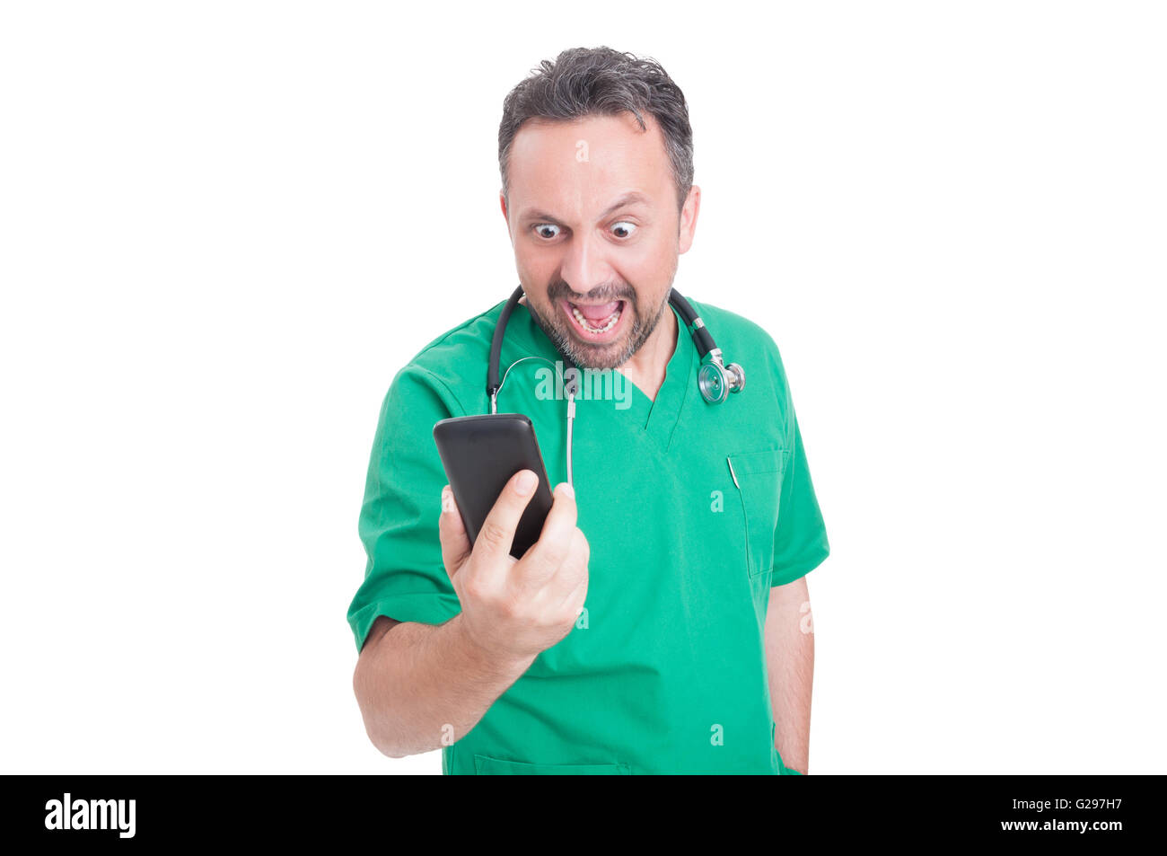 Angry doctor looking and yelling at his smartphone isolated on white ...