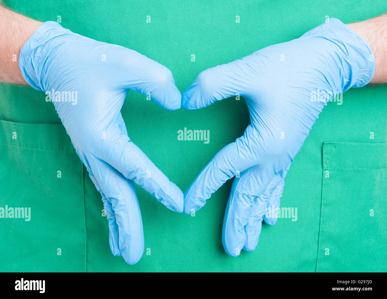 Doctor hand making heart shape or symbol. Cardiologist showing heart ...
