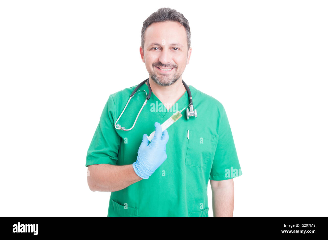 Smiling doctor holding a syringe with yellow medication ready to inject ...