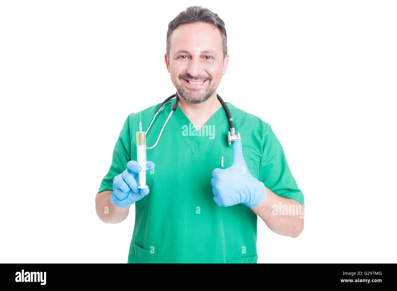 Confident doctor holding syringe and showing like while smiling on ...