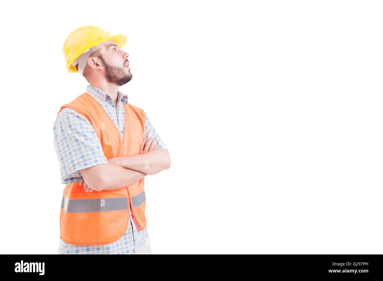 Surprised builder or engineer looking up isolated on white background ...