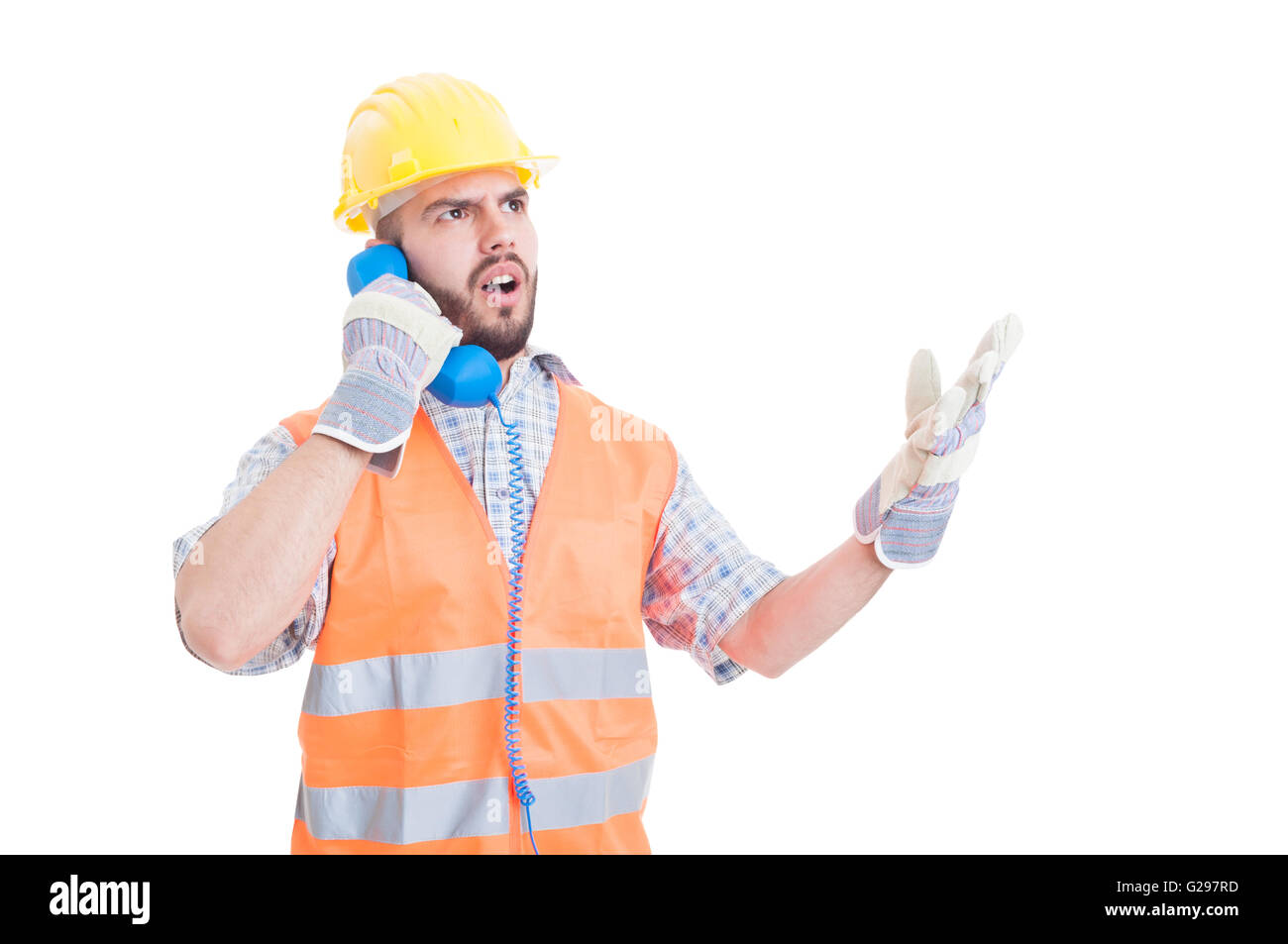 Upset or mad builder arguing on the phone wearing yellow helmet and ...