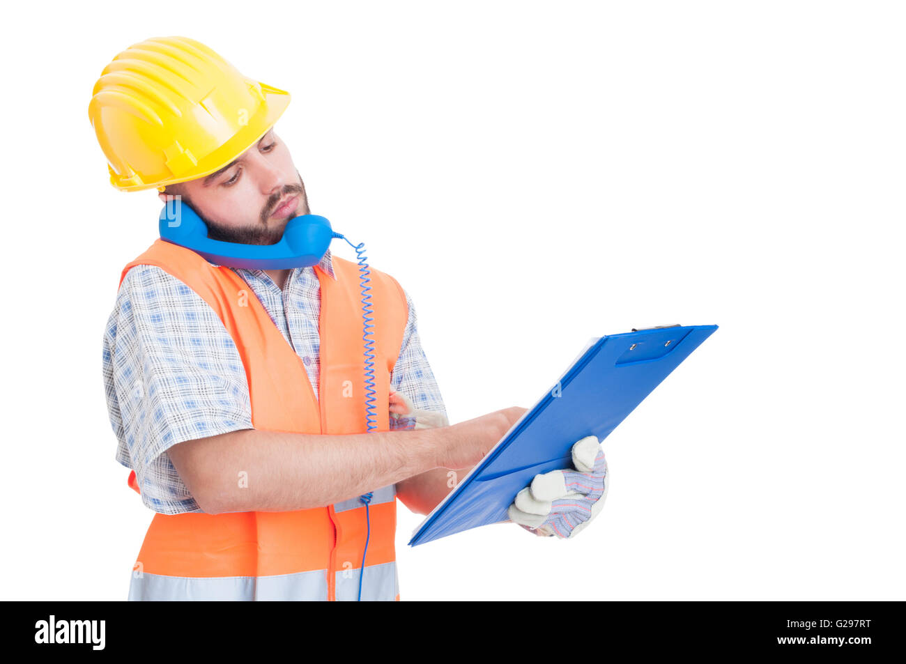 Busy builder using phone while holding clipboard. Support or assistance ...