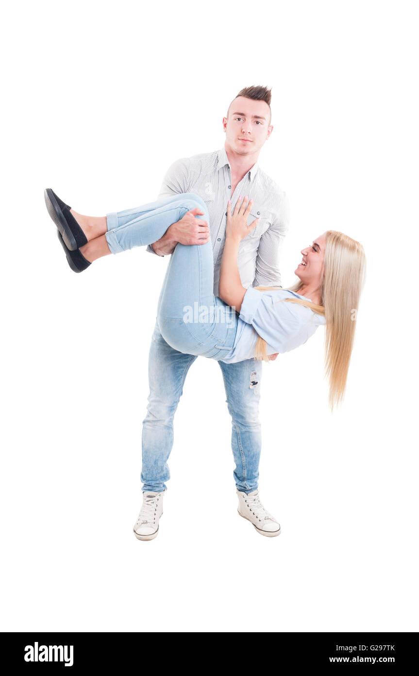 Playful man dropping girl for fun. Happy couple concept on white ...