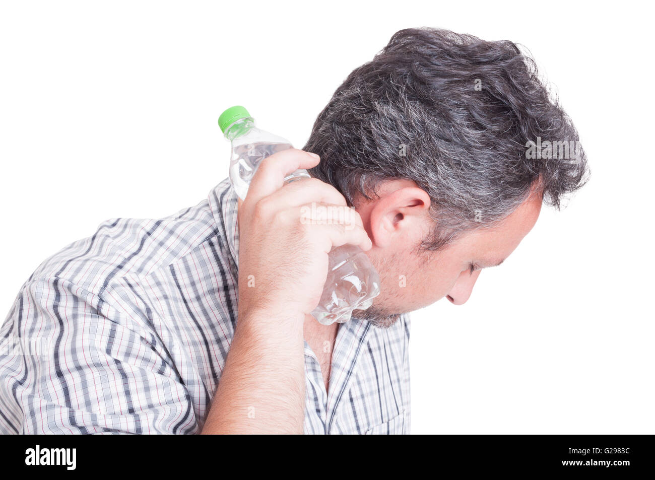 Man cooling down with a bottle of cold water as summer heat or heatwave ...