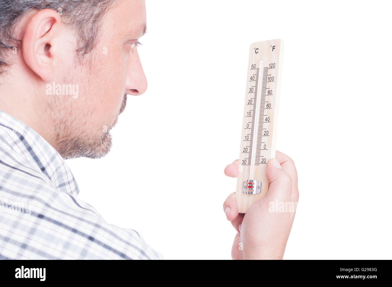 Man holding thermometer and checking temperature isolated on white ...
