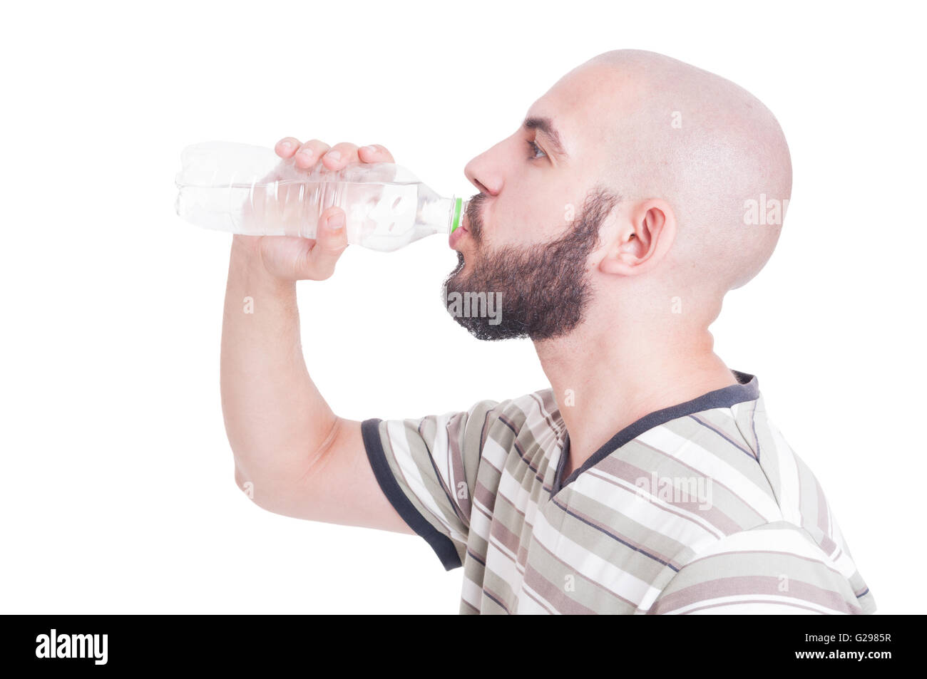 Guy drinking water from plastic bottle as summer season hydrating ...