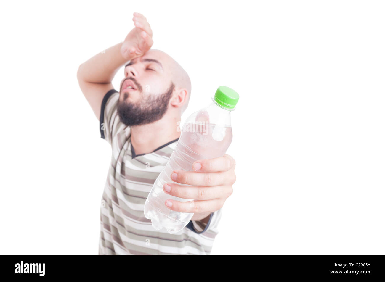 Sweaty man holding a bottle of cold water isolated on white Stock Photo ...